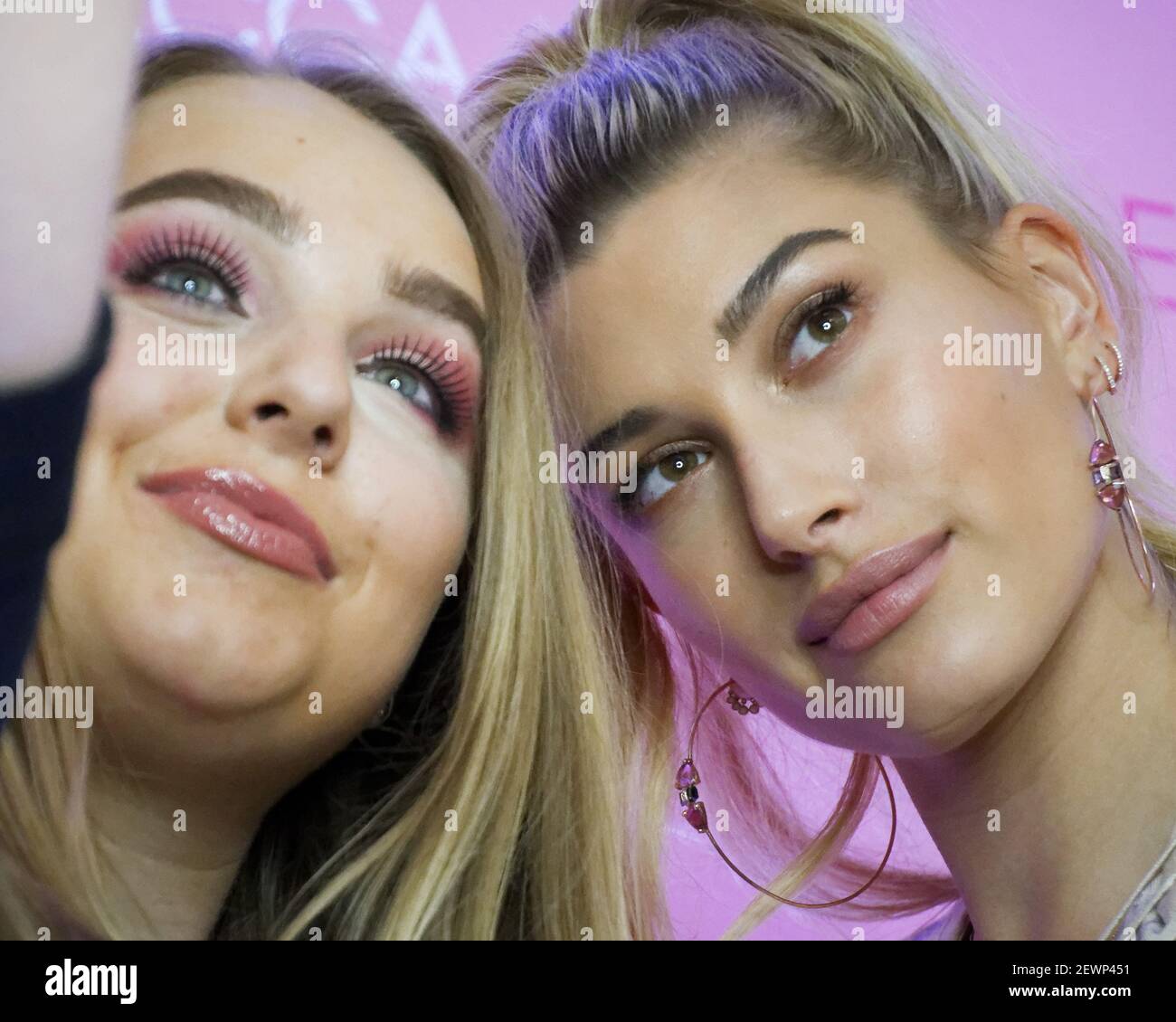 Model Hailey Baldwin (R) meets fans following the launch of her ...