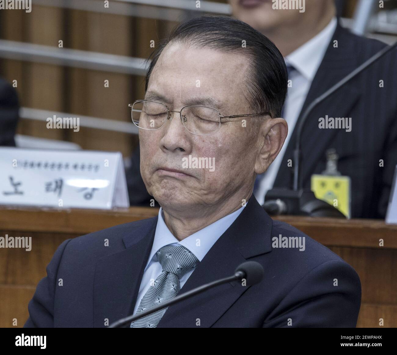 Kim Ki Choon of the Chief Presidential Secretary attend seated with ...