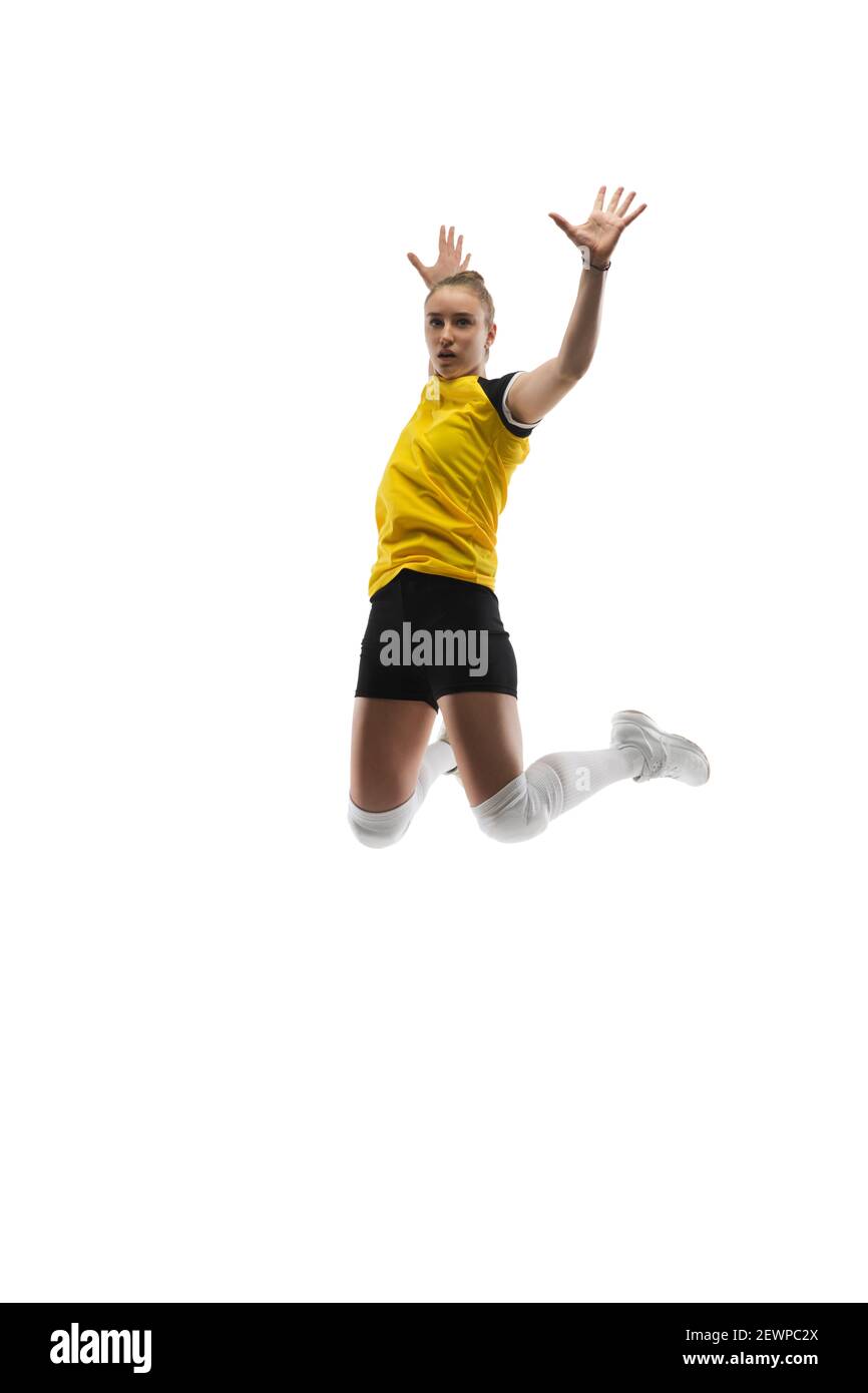 Flying. Young female volleyball player isolated on white studio ...