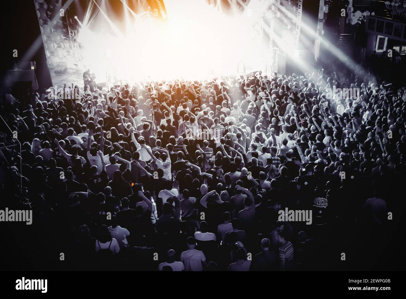Raised hands in honor of a musical show on stage Stock Photo - Alamy