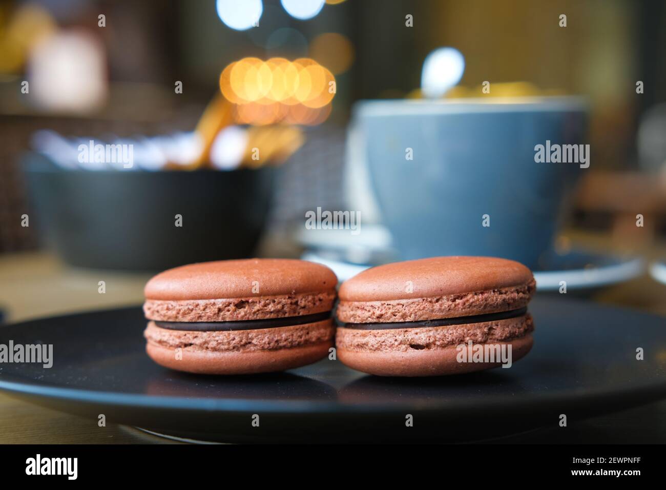 Close up of macaroon in a plate on cafe table Stock Photo - Alamy