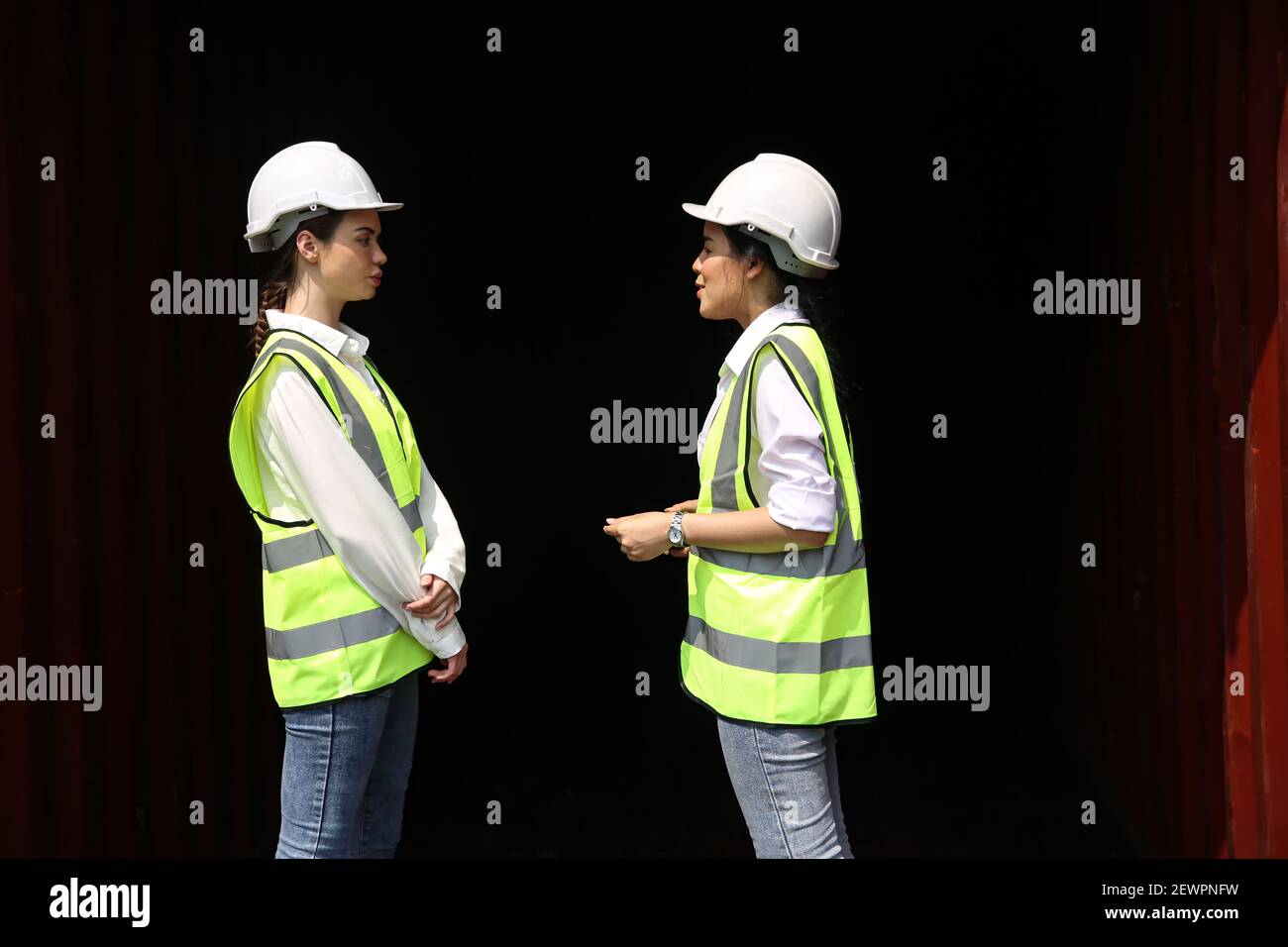 Logistics engineer control at the port, loading containers for trucks ...