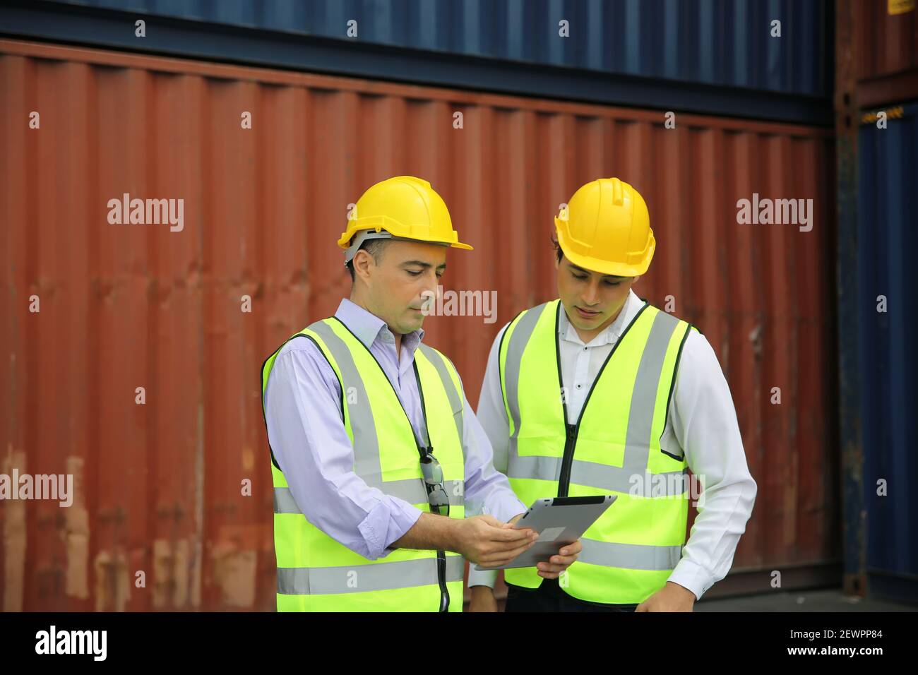 Logistics engineer control at the port, loading containers for trucks ...