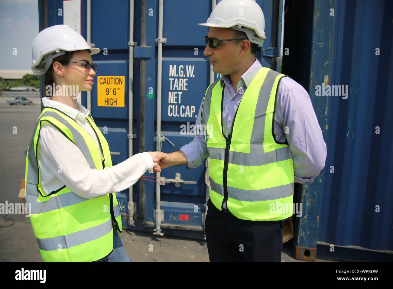 Logistics engineer control at the port, loading containers for trucks ...
