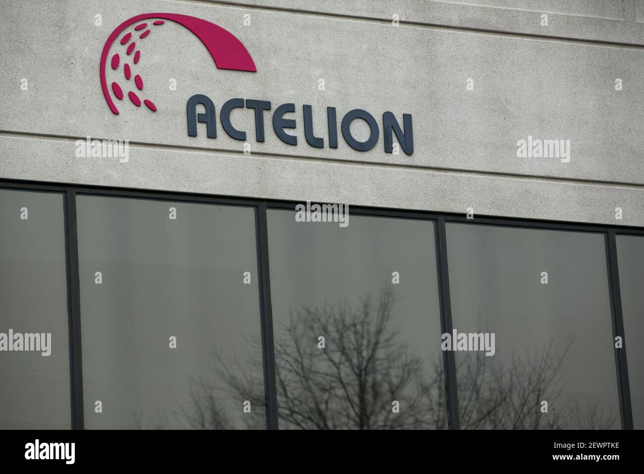 A logo sign outside of a facility occupied by Actelion Pharmaceuticals ...