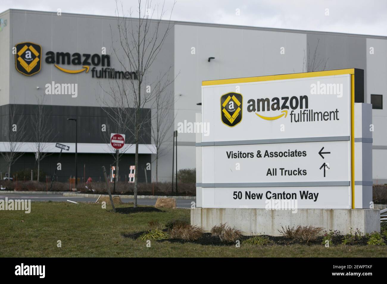 A logo sign outside of an Amazon Fulfillment center in Robbinsville ...