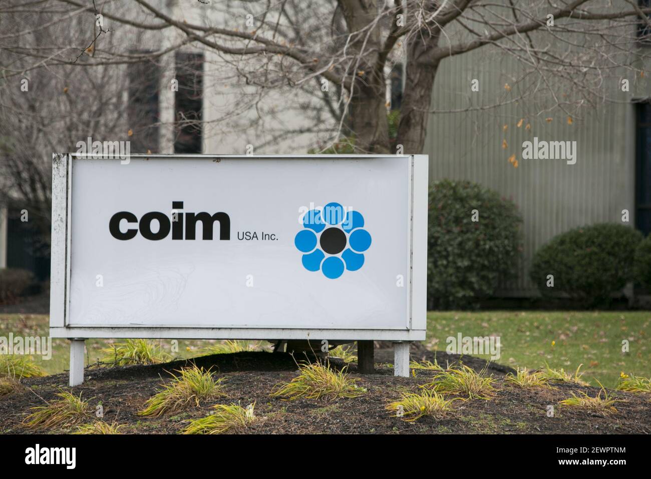 A logo sign outside of a facility occupied by Coim USA, Inc., in West ...