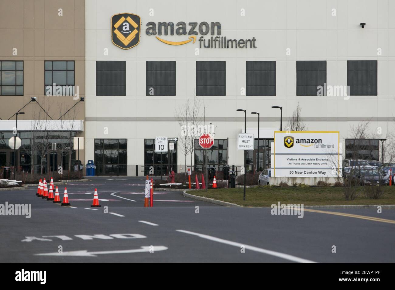 A logo sign outside of an Amazon Fulfillment center in Robbinsville ...