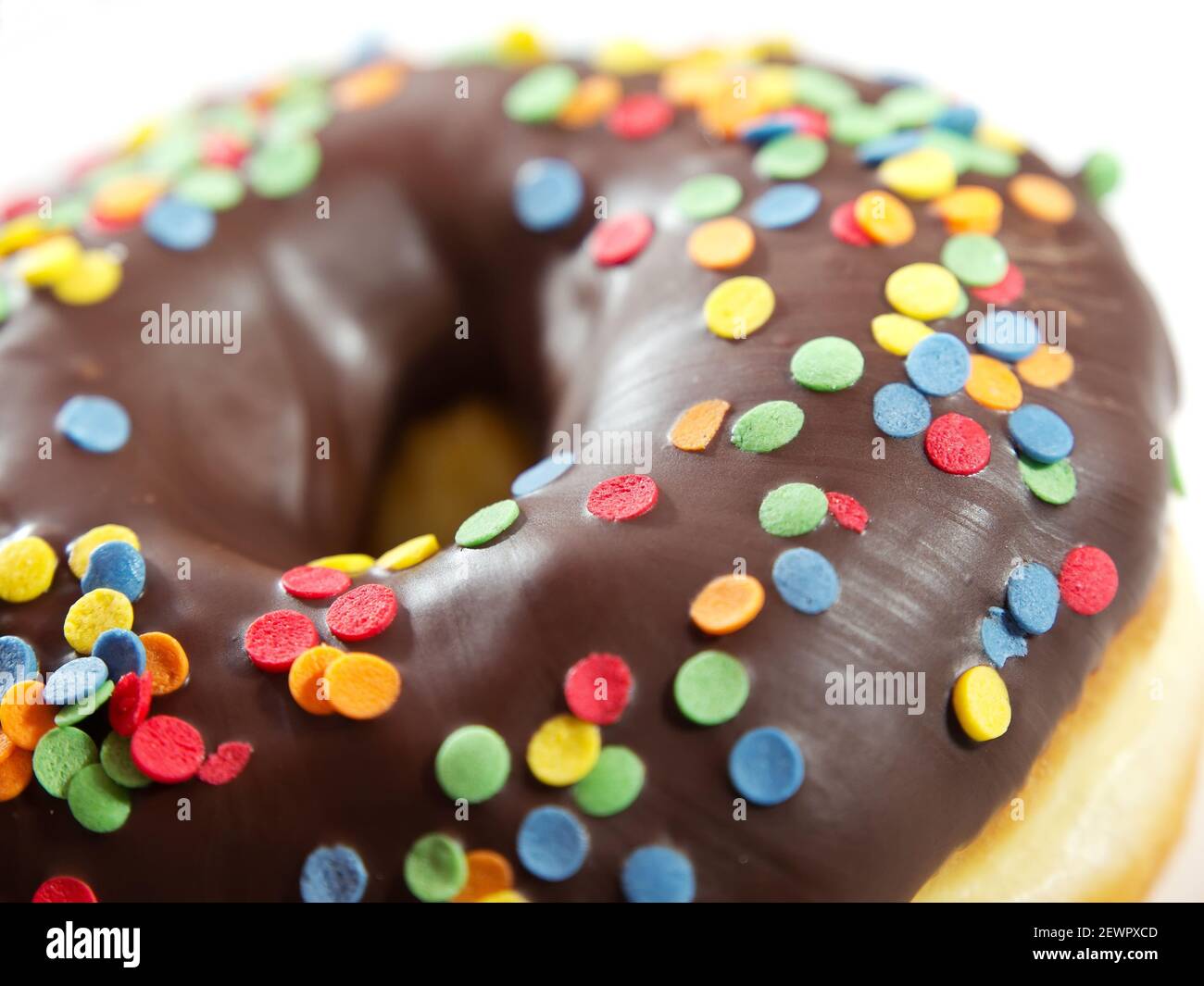 delicious chocolate glazed donut or doughnut with colorful sprinkles ...