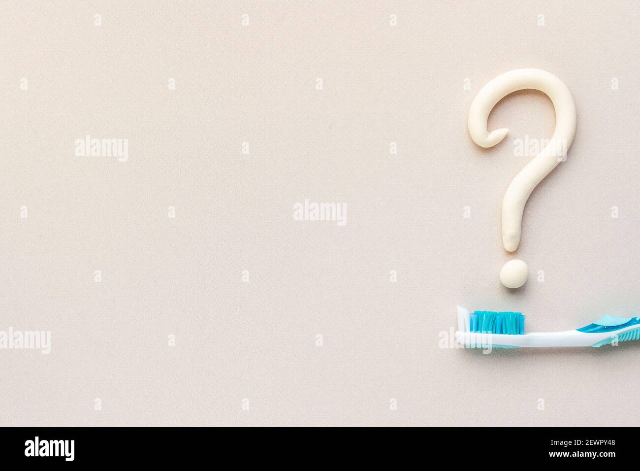 Question mark of toothpaste with toothbrush, top view. Oral care and ...