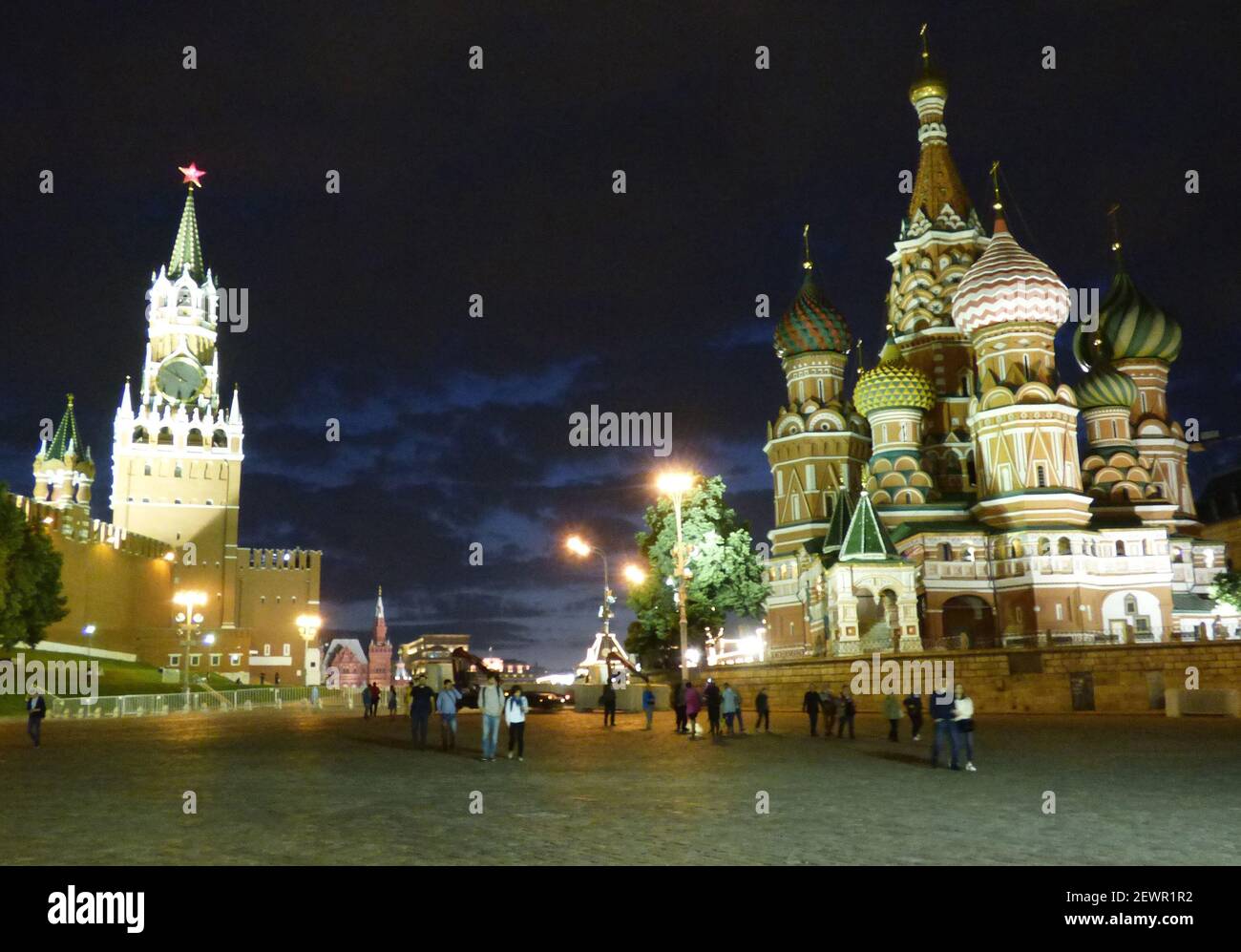 Moscow lights up at night with St. Basil's Cathedral, right, and the ...