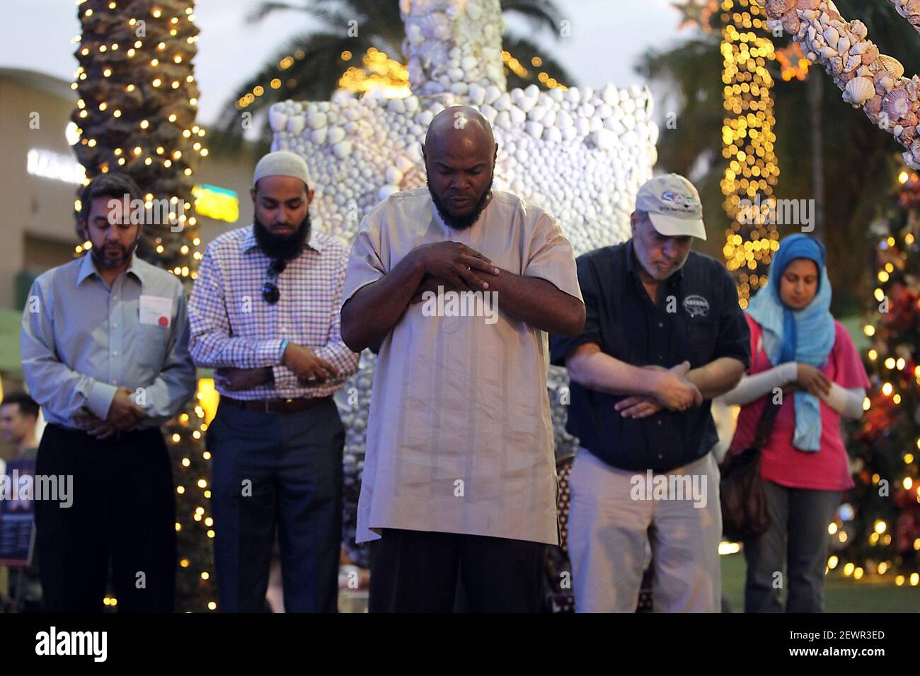 Vincent Yusuf Ware, center, leads a group in Muslim prayer, as they ...