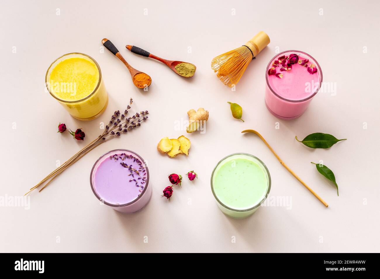 Green, yellow and pink latte. Hot colorful coffee or tea with milk ...