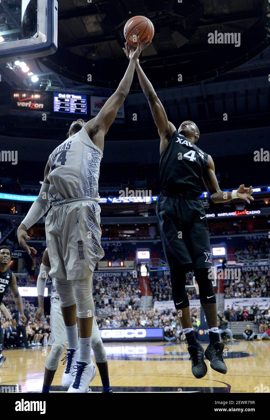 Georgetown forward Marcus Derrickson (24) and Xavier guard Edmond ...