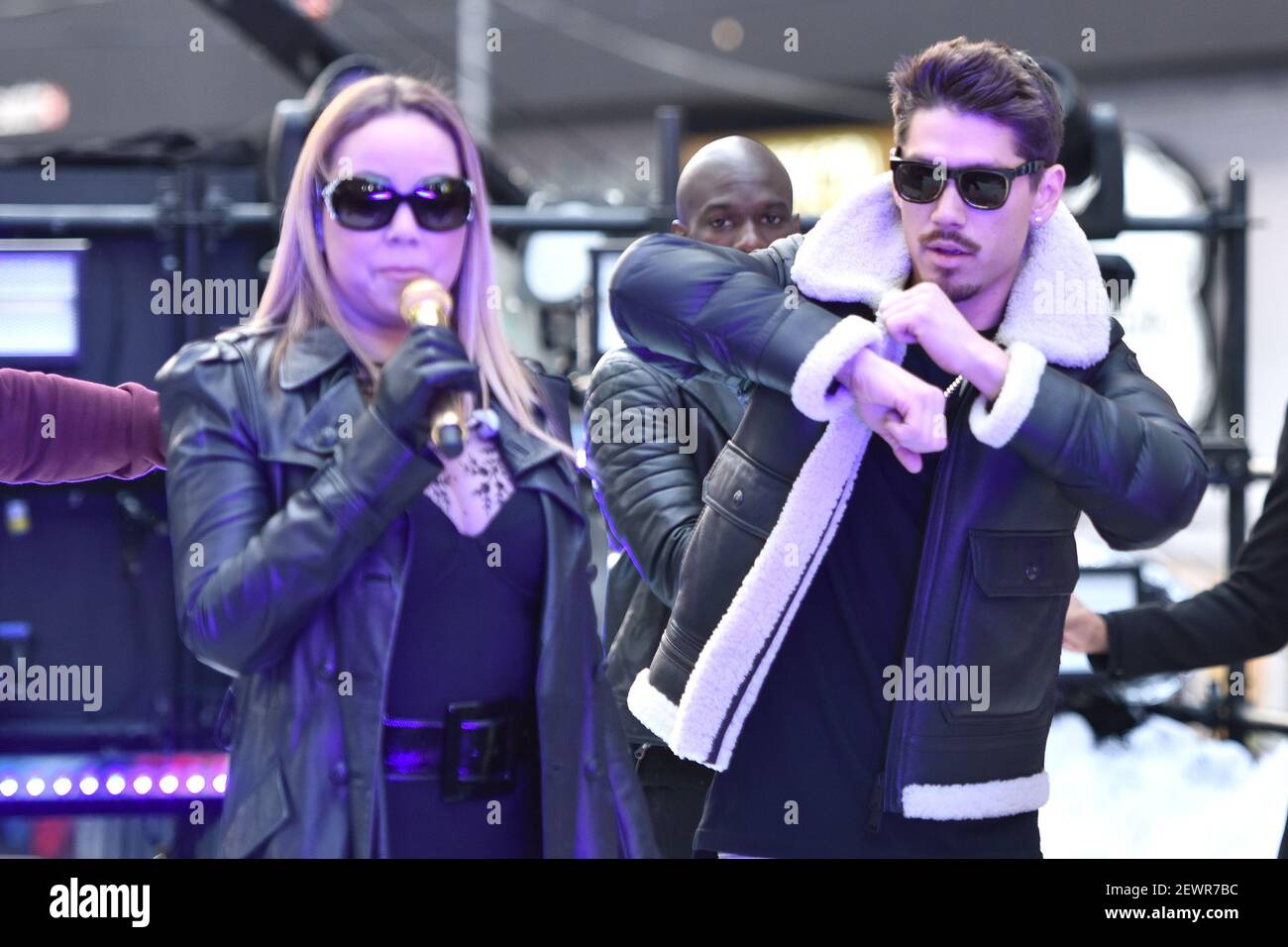 Singer Mariah Carey and choreographer Bryan Tanaka perform during ...