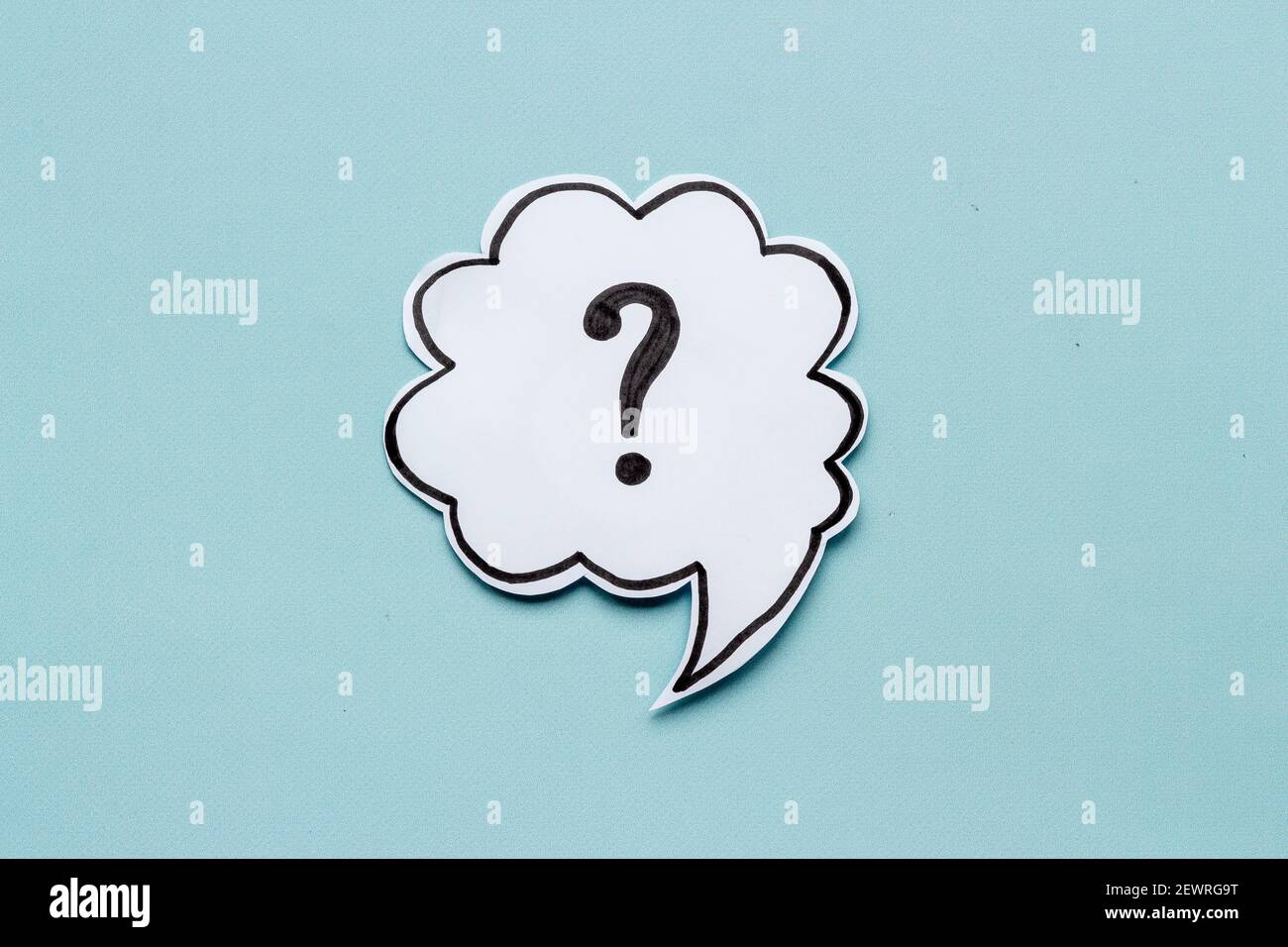 Question mark symbol on speech bubble, top view Stock Photo - Alamy
