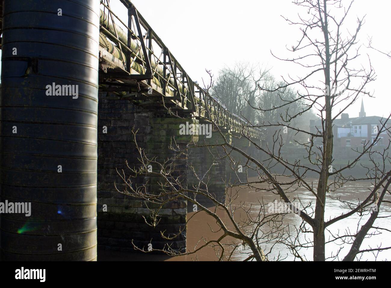 Riverside gas pipe bridge Stock Photo - Alamy