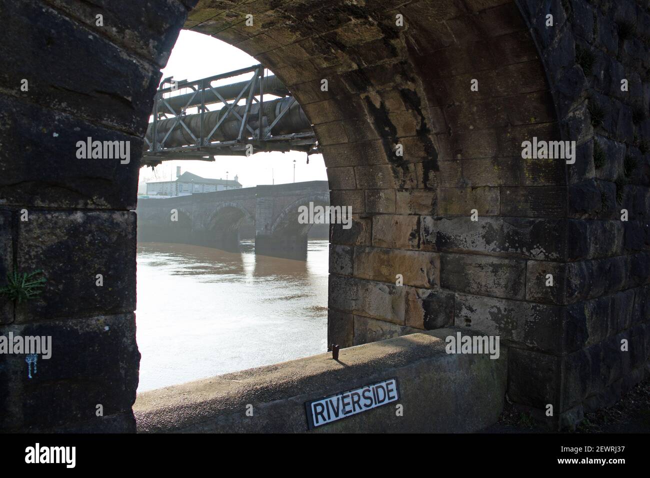 Riverside gas pipe bridge Stock Photo - Alamy