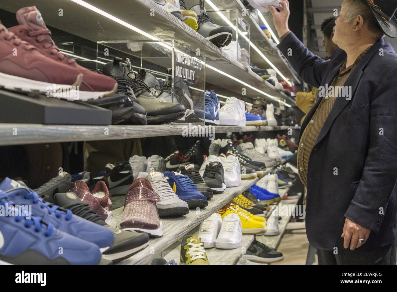 Customers crowd the new Nike flagship store on opening day in Soho in ...