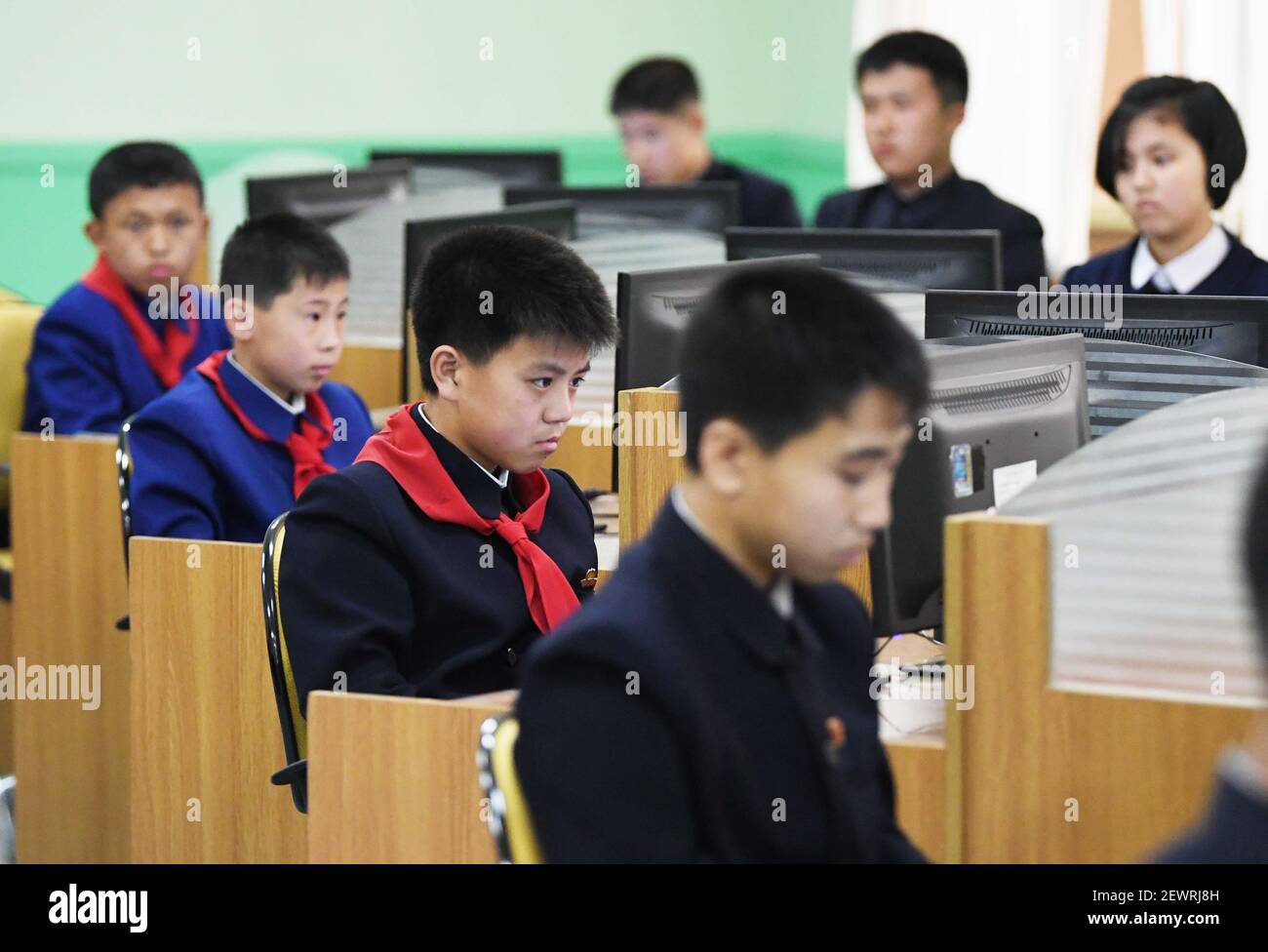 Children work on computers in uniforms. General views of North Korea ...