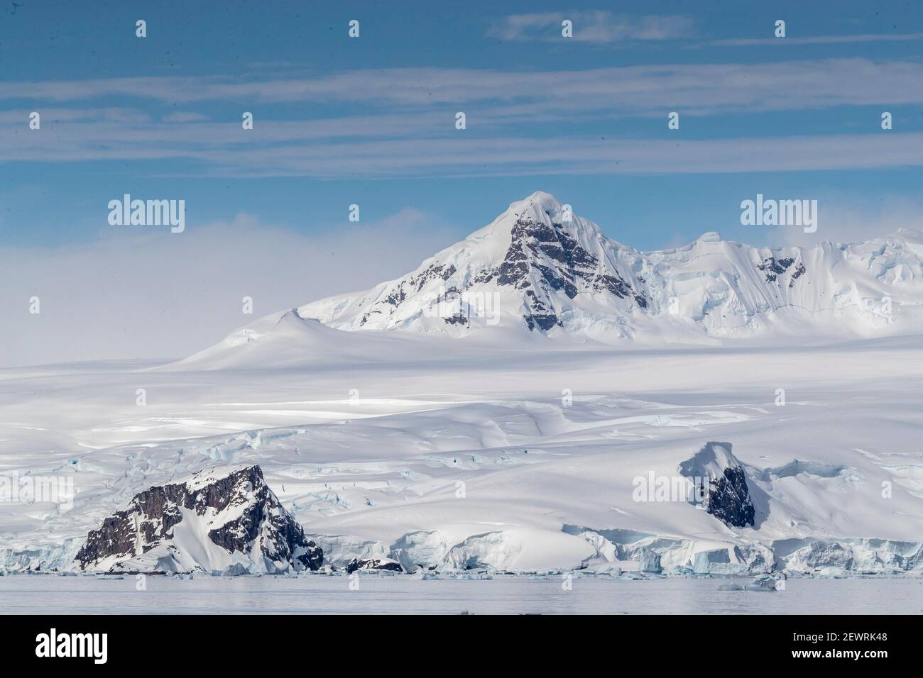 Snow-covered mountains and tidewater glaciers in Mikkelsen Harbor ...