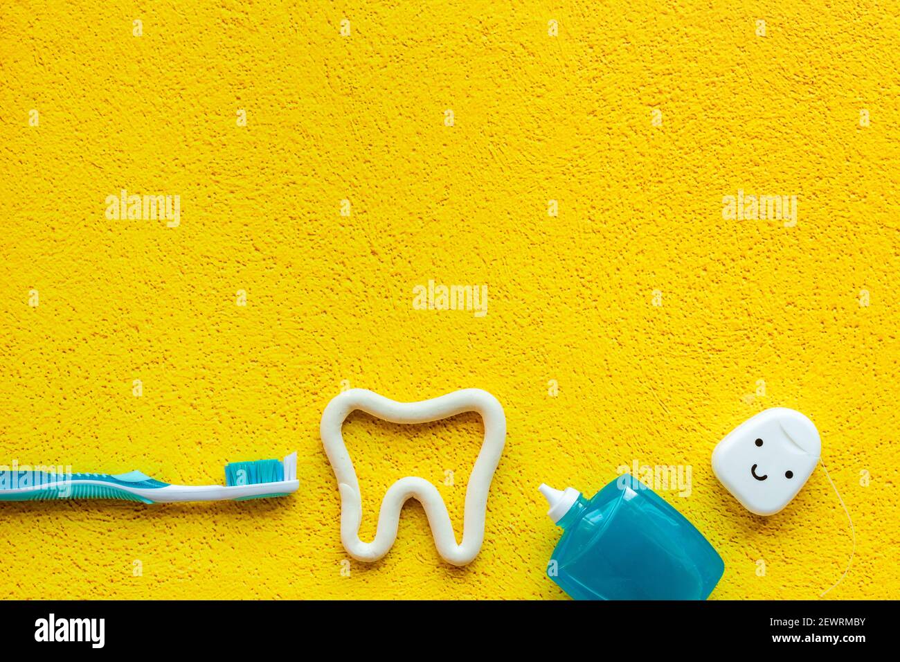 Tooth shape with tube of toothpaste and toothbrush. Dental hygiene ...