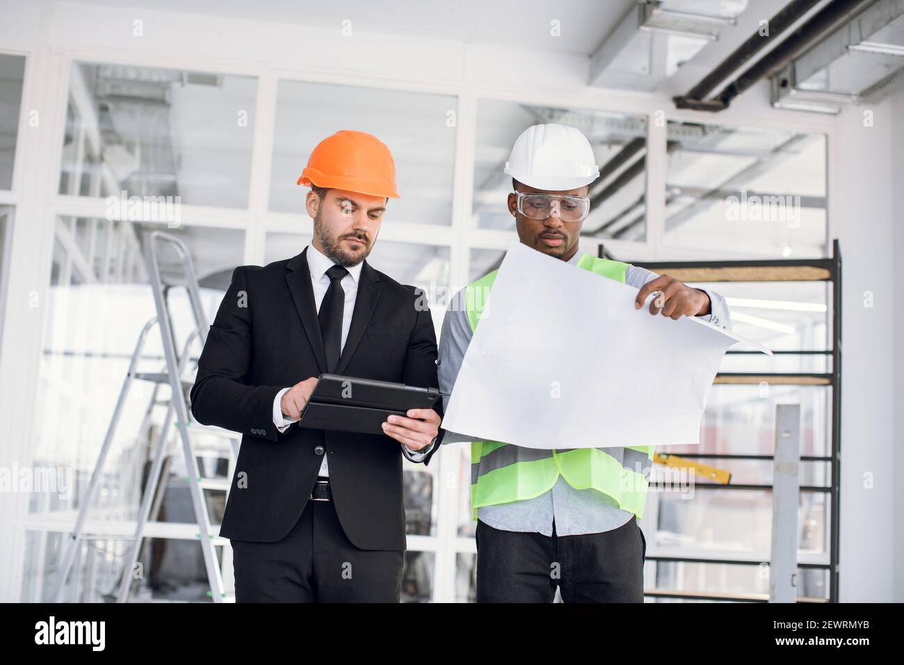 International business partners doing drawings inspection Stock Photo ...