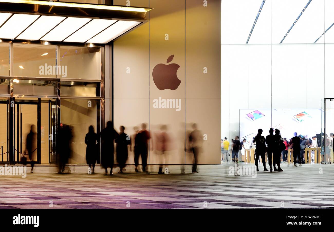--FILE--Pedestrians walk past an Apple Store in Qingdao city, east ...