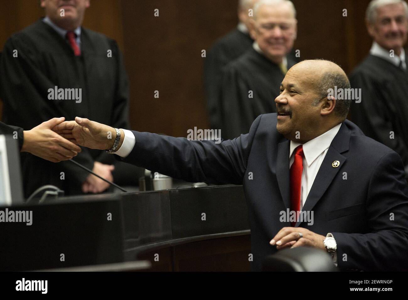 Edward L. Gilmore shakes the hands of various judges after he was sworn ...