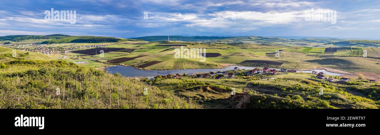 Panorama of Chinteni village and lake in summer, Romania, Europe Stock ...