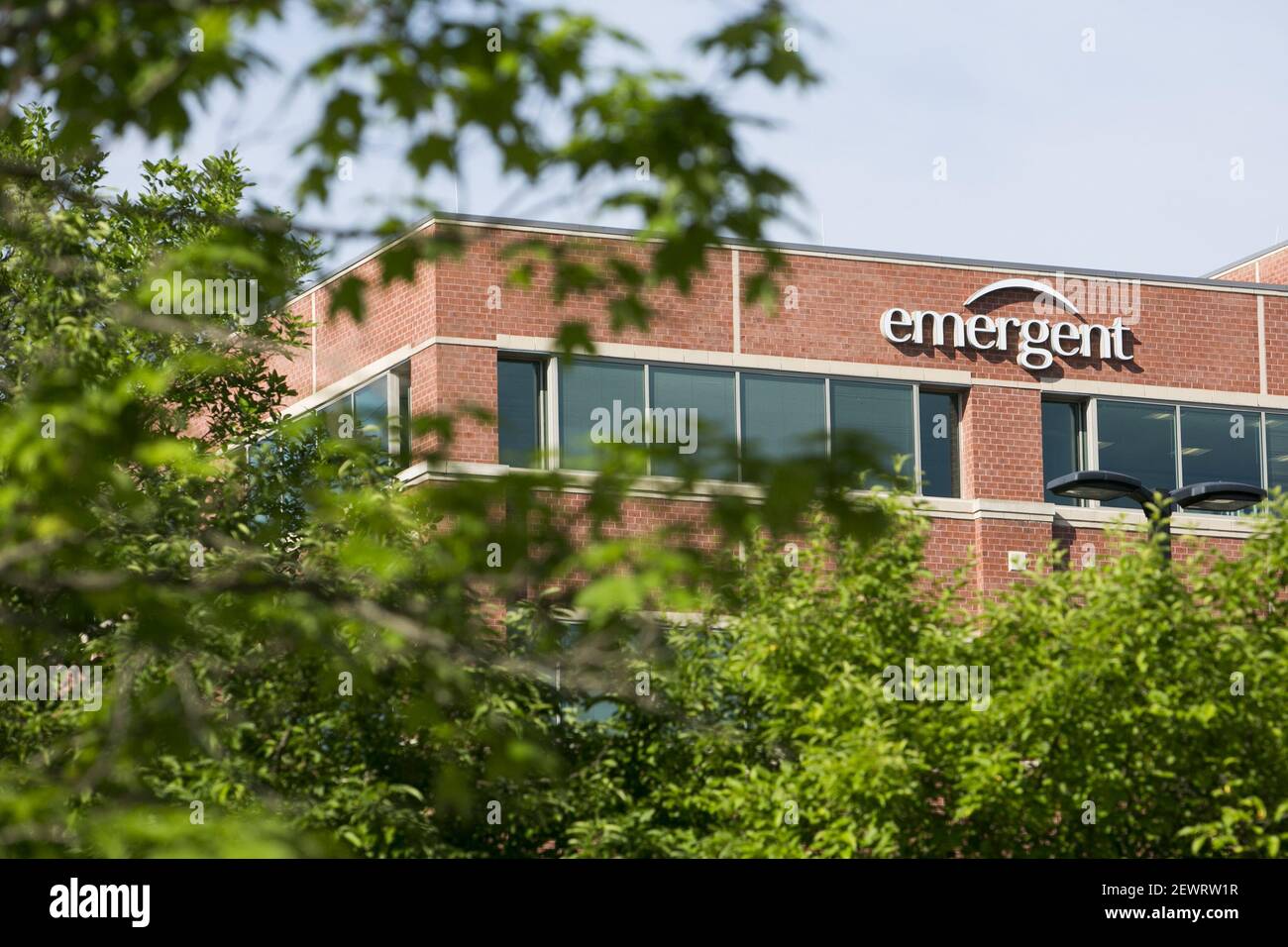A logo sign outside of the headquarters of Emergent BioSolutions in ...