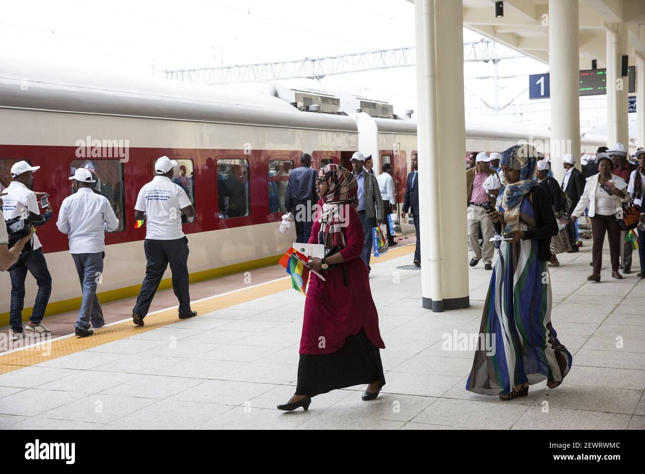--FILE--Local citizens take the first train that will run on the Addis ...