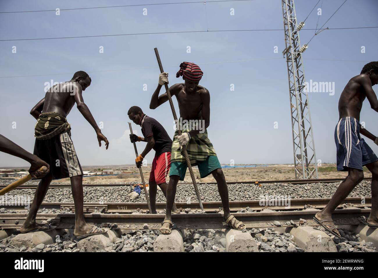 --FILE--African workers maintain and check the Addis Ababaâ€“Djibouti ...