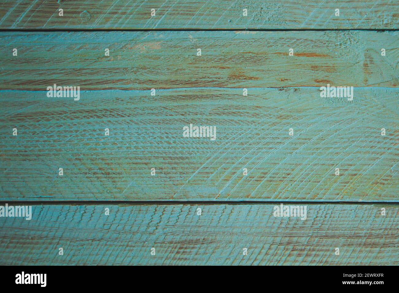 The burnt pine boards are painted with blue paint. Wooden background ...