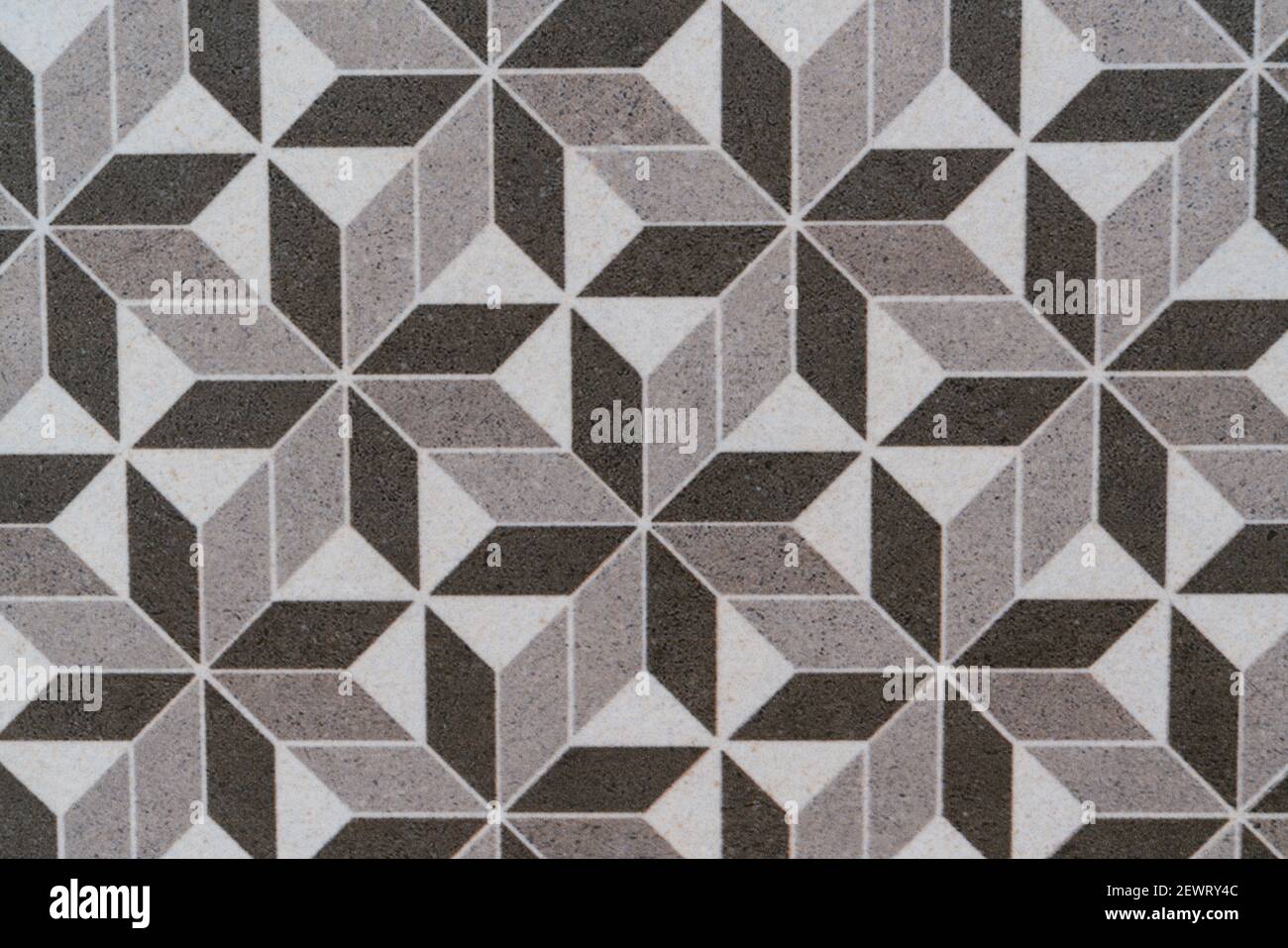 an illustration of brown and black rhombus-shaped forms on a white ...