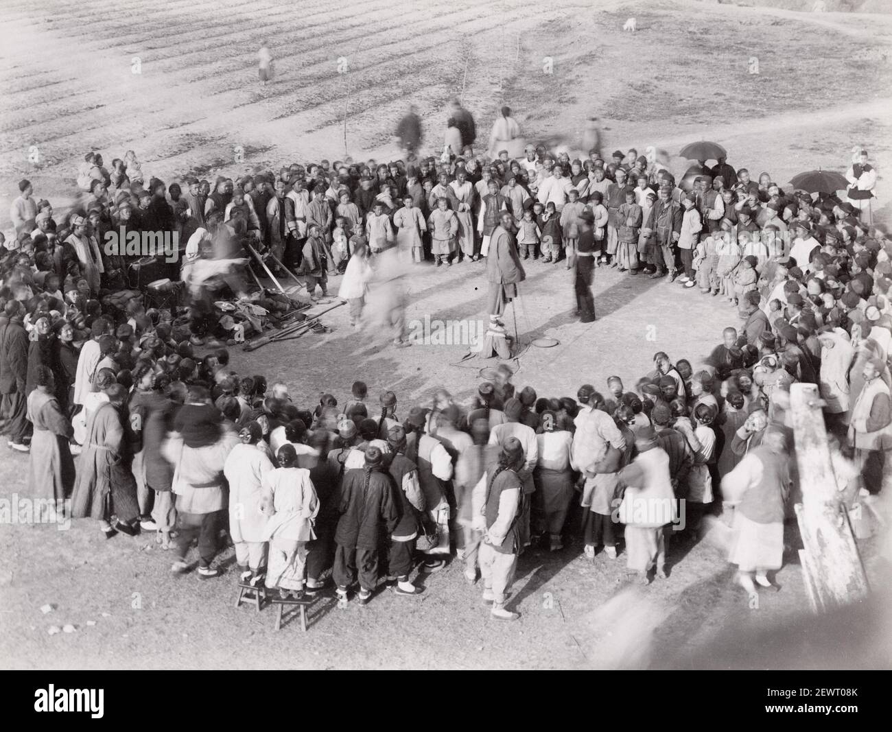 Vintage late 19th century photograph: Street performers and large crowd ...