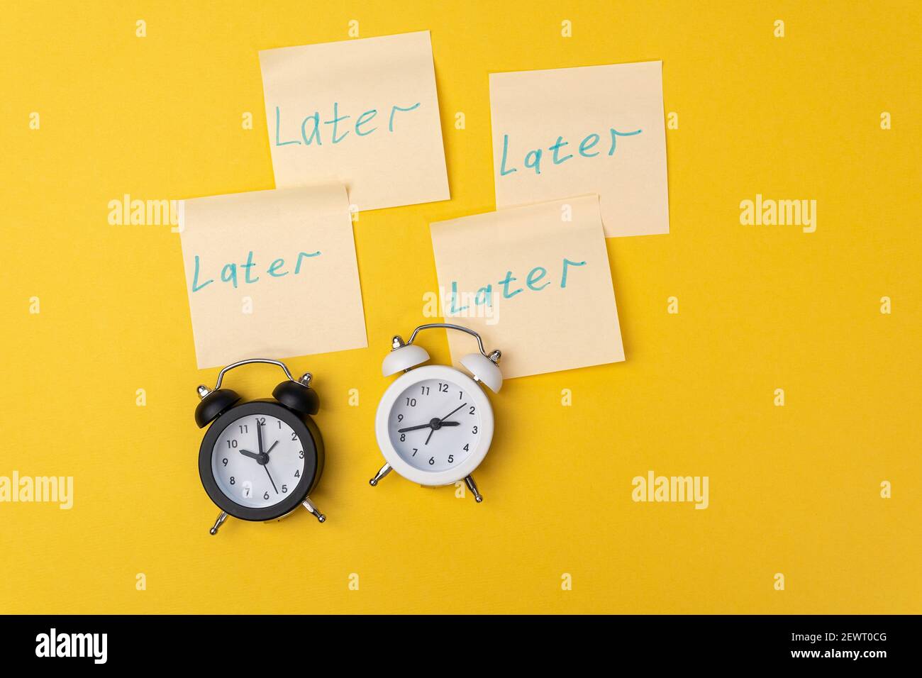 Alarm clock with sticky notes later, tomorrow, next day and after on ...