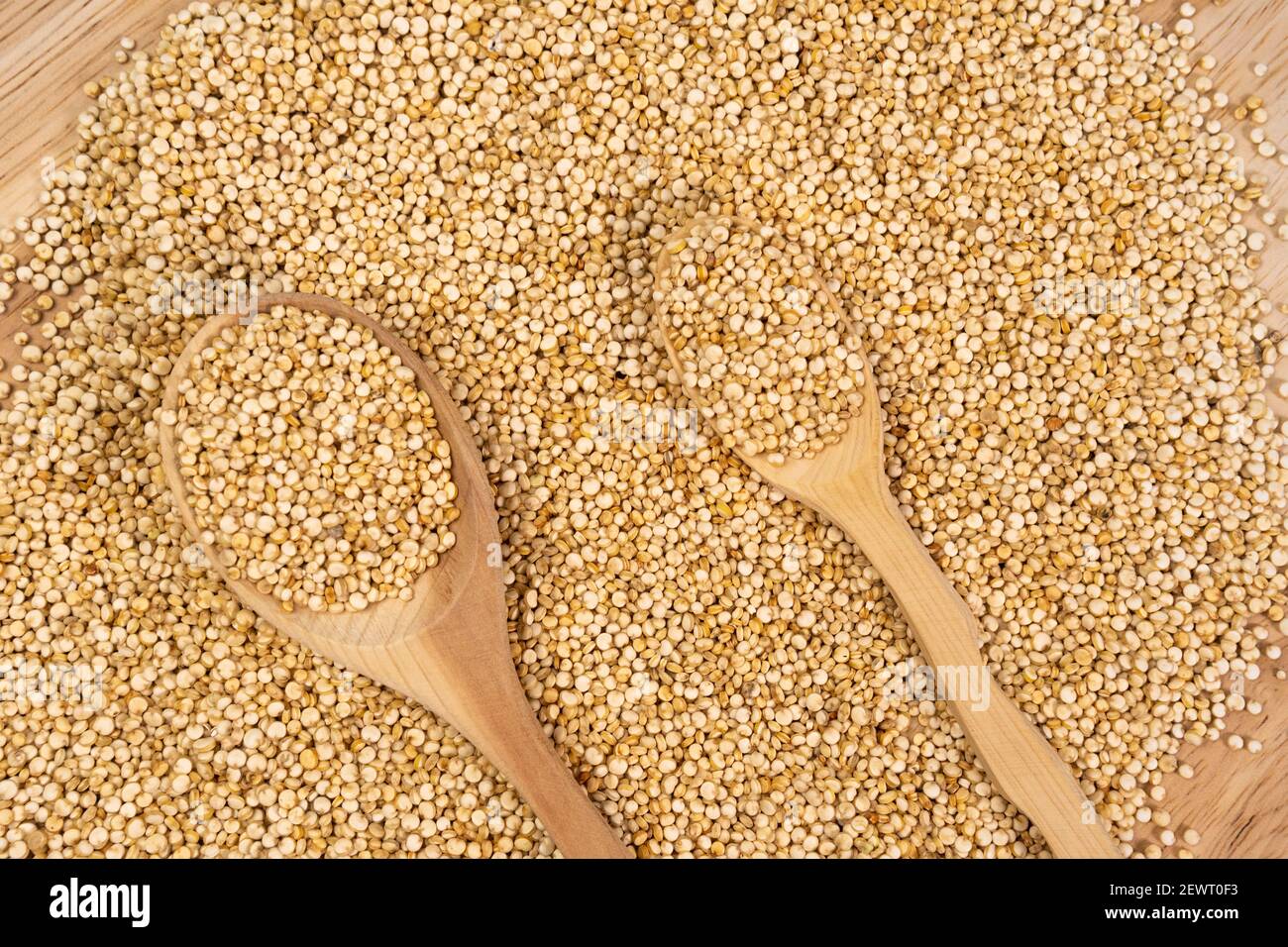 quinoa texture with wooden spoons. quinoa background. quinoa seed. top ...