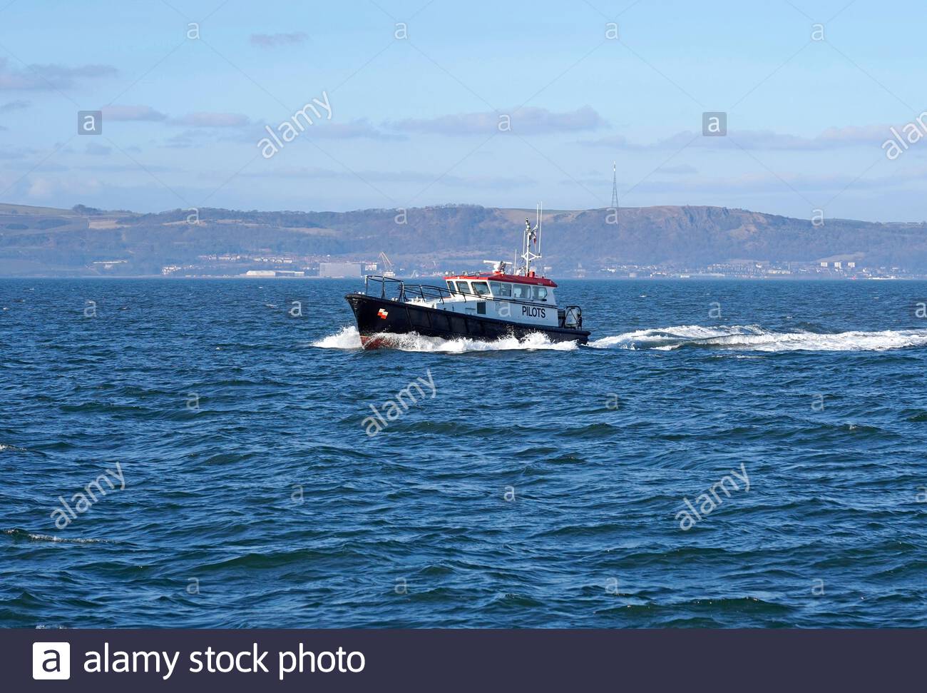 Forth Ports Pilot boat approaching Granton harbour, Edinburgh, Scotland ...