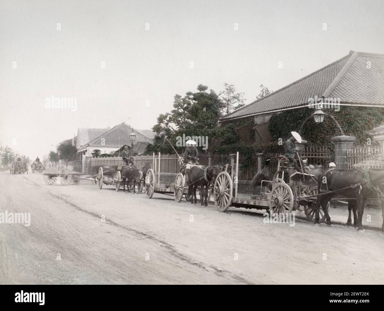 Vintage late 19th century photograph: Horse carts, cargo wagons, Bund ...