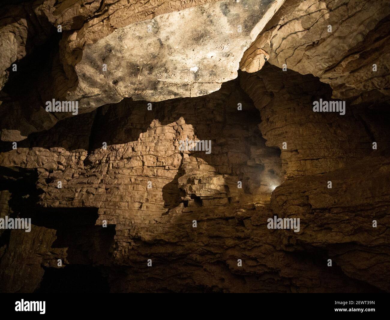 Dimmed light coming through in dark cave,Shot on North Island of New ...