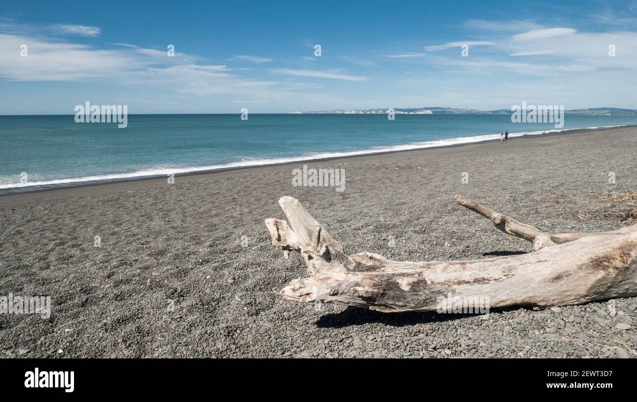 Coastal scenery with calm ocean and beach with blue sky backdrop. Shot ...