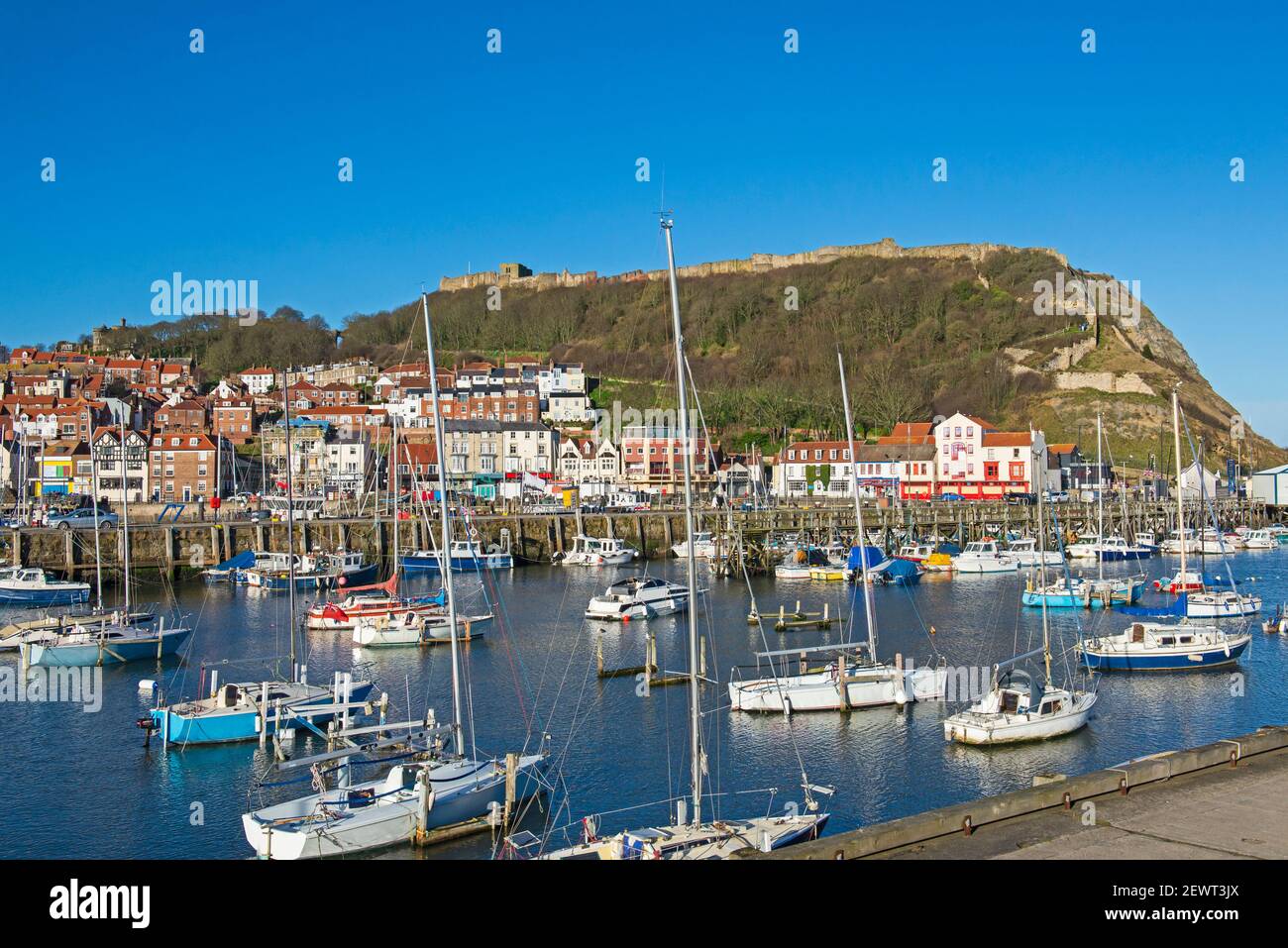 Landscape panorama view of coastal seaside town harbor front with ...