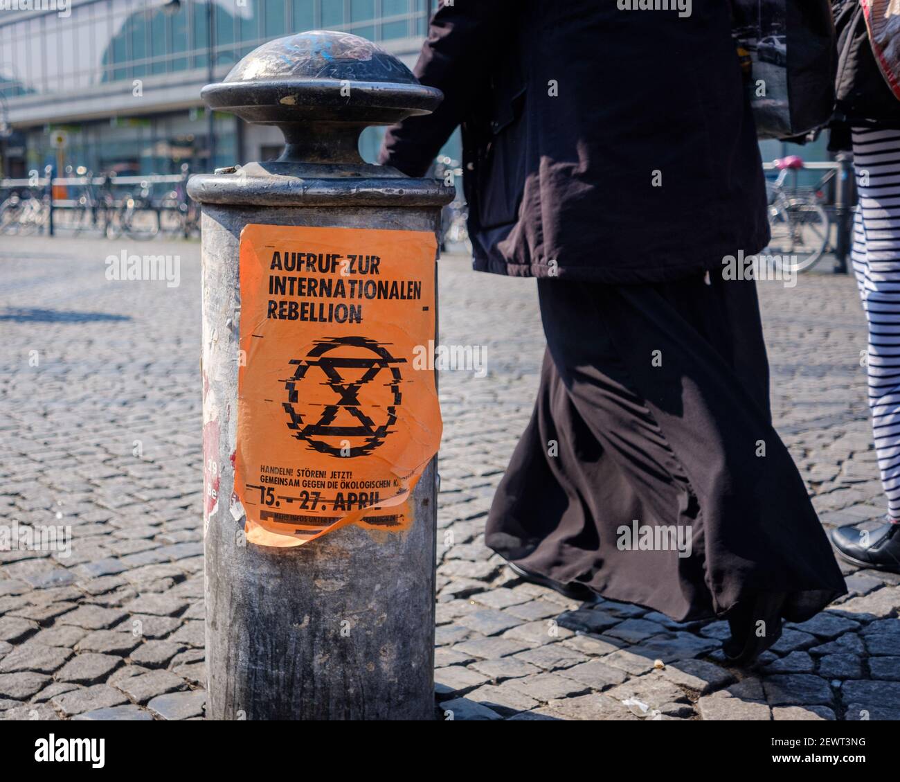 Torn Extinction Rebellion climate action poster at Alexanderplatz in ...