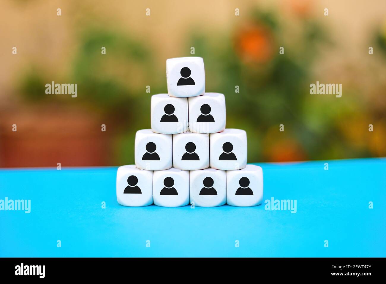 blocks stacked as pyramid hierarchy with people icons. Power of ...