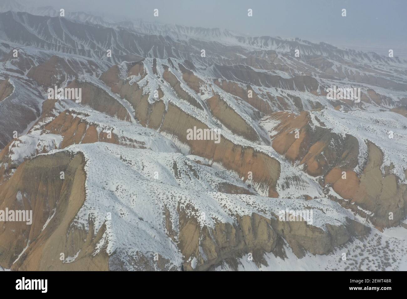Aerial photos of colorful Hongshanzui on which the snow has not melted ...
