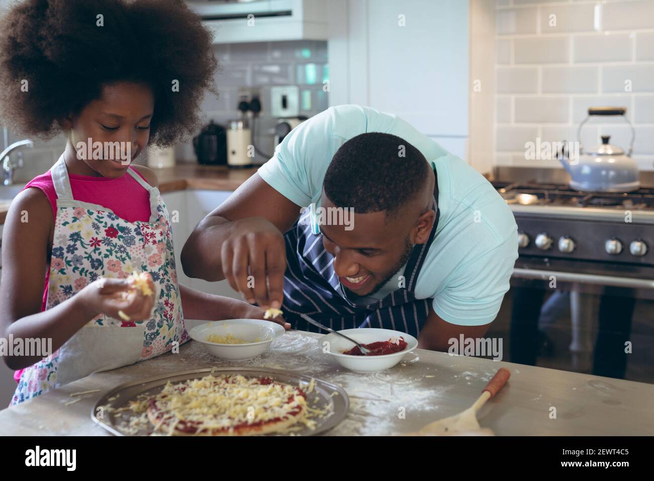 Dad and girl cooking together hi-res stock photography and images - Alamy