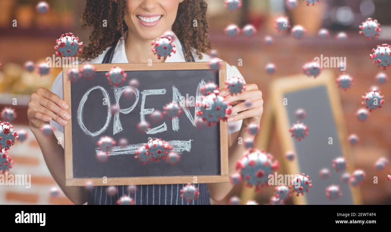 Covid-19 cells floating over mixed race female chef Stock Photo - Alamy