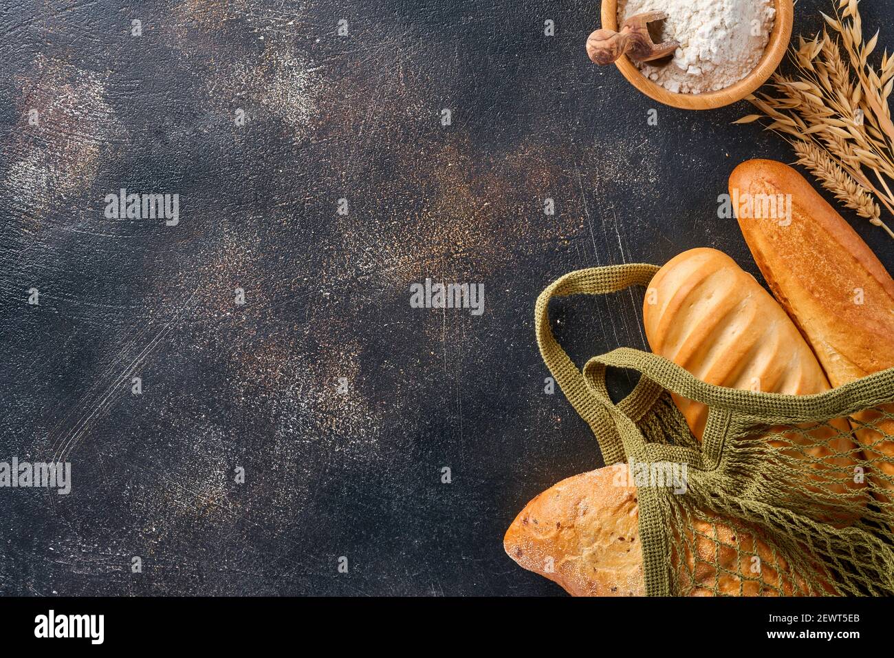 Various crispy breads and buns in mesh bags or shopping bag, wheat ...