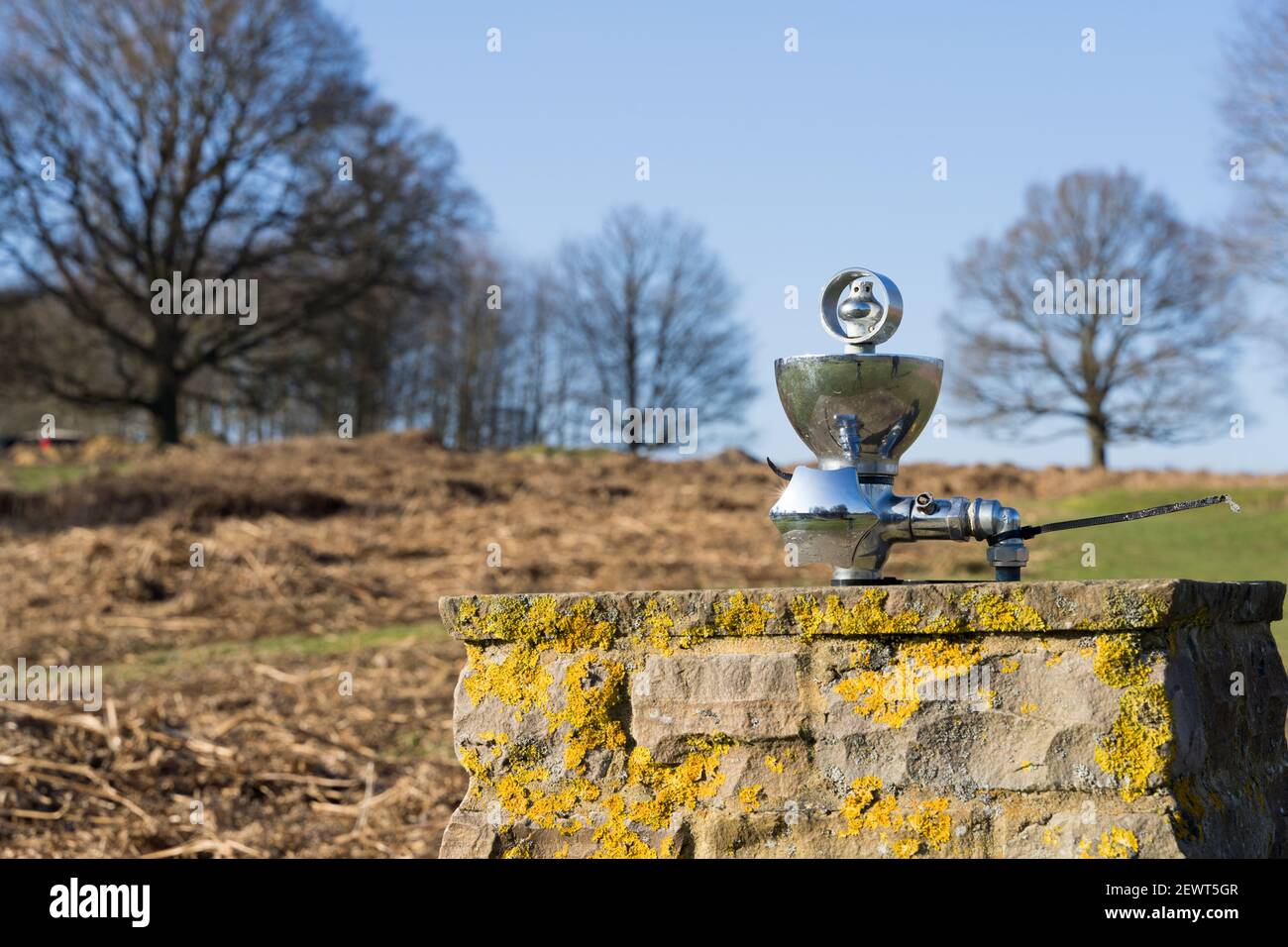 stainless steel water tap shining in the sunin countryside park, Knole ...